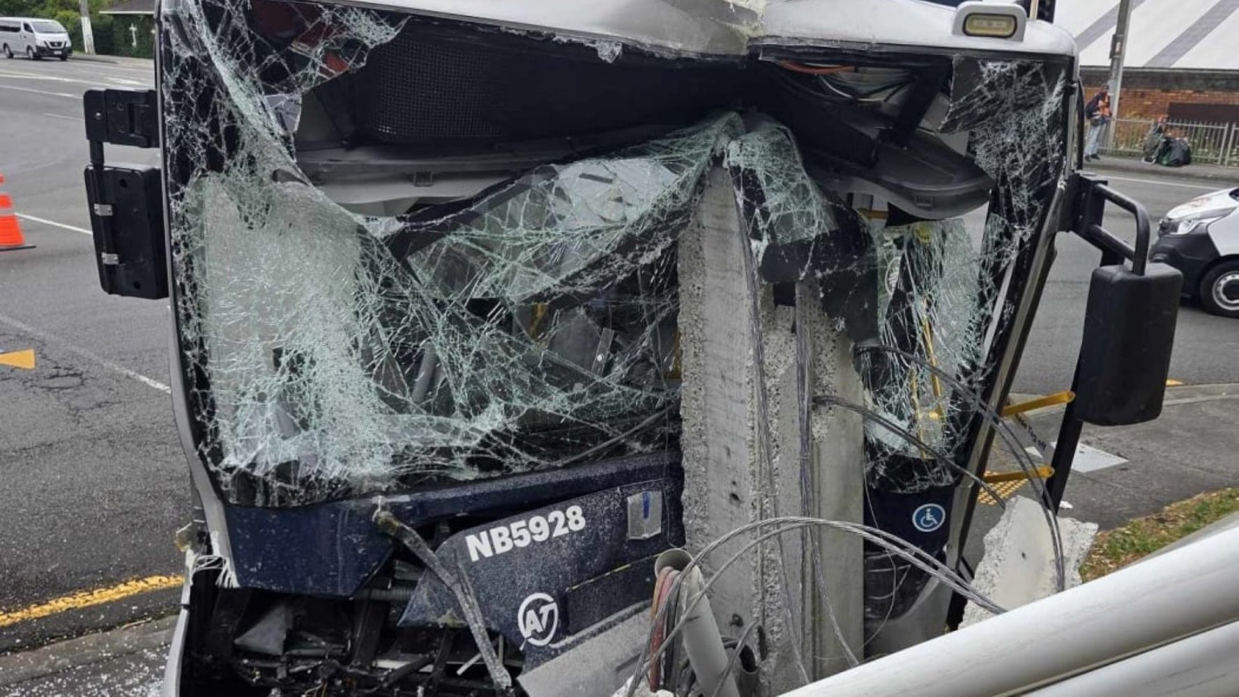Auckland Transport bus crashes into power pole, damages building