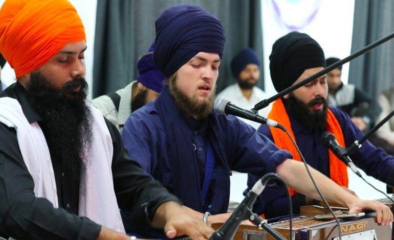 Sikh musician-swim coach inspires community with dual talent